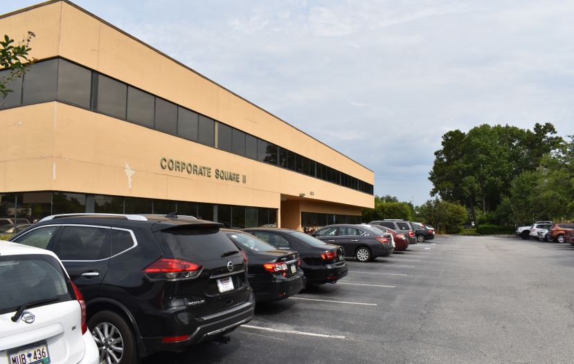 Pete Harper, CCIM, Reid Davis, CCIM, SIOR, and Cameron Yost represented ...